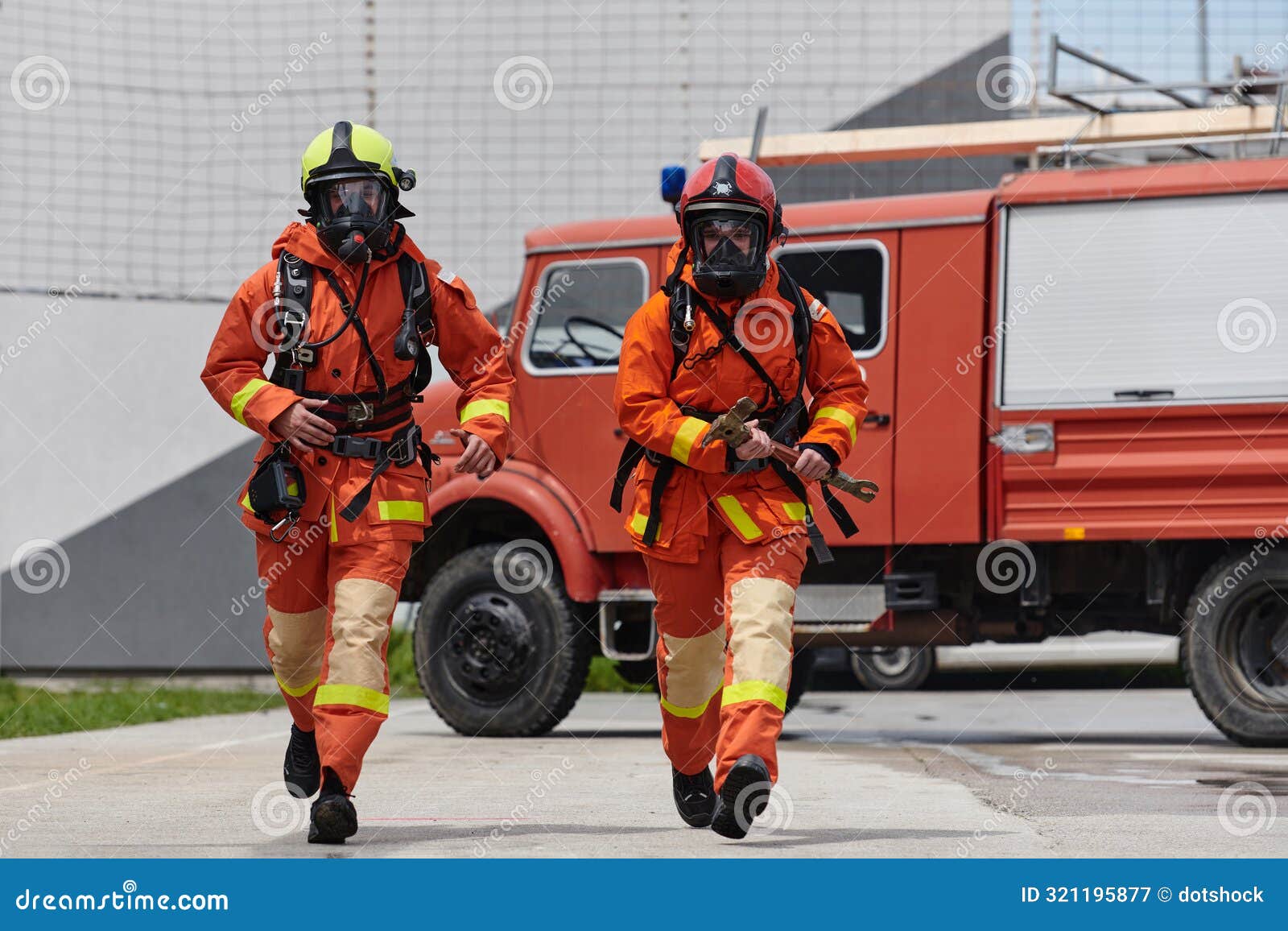 Firefighter Team Training with Various Tools in Professional Gear Stock ...