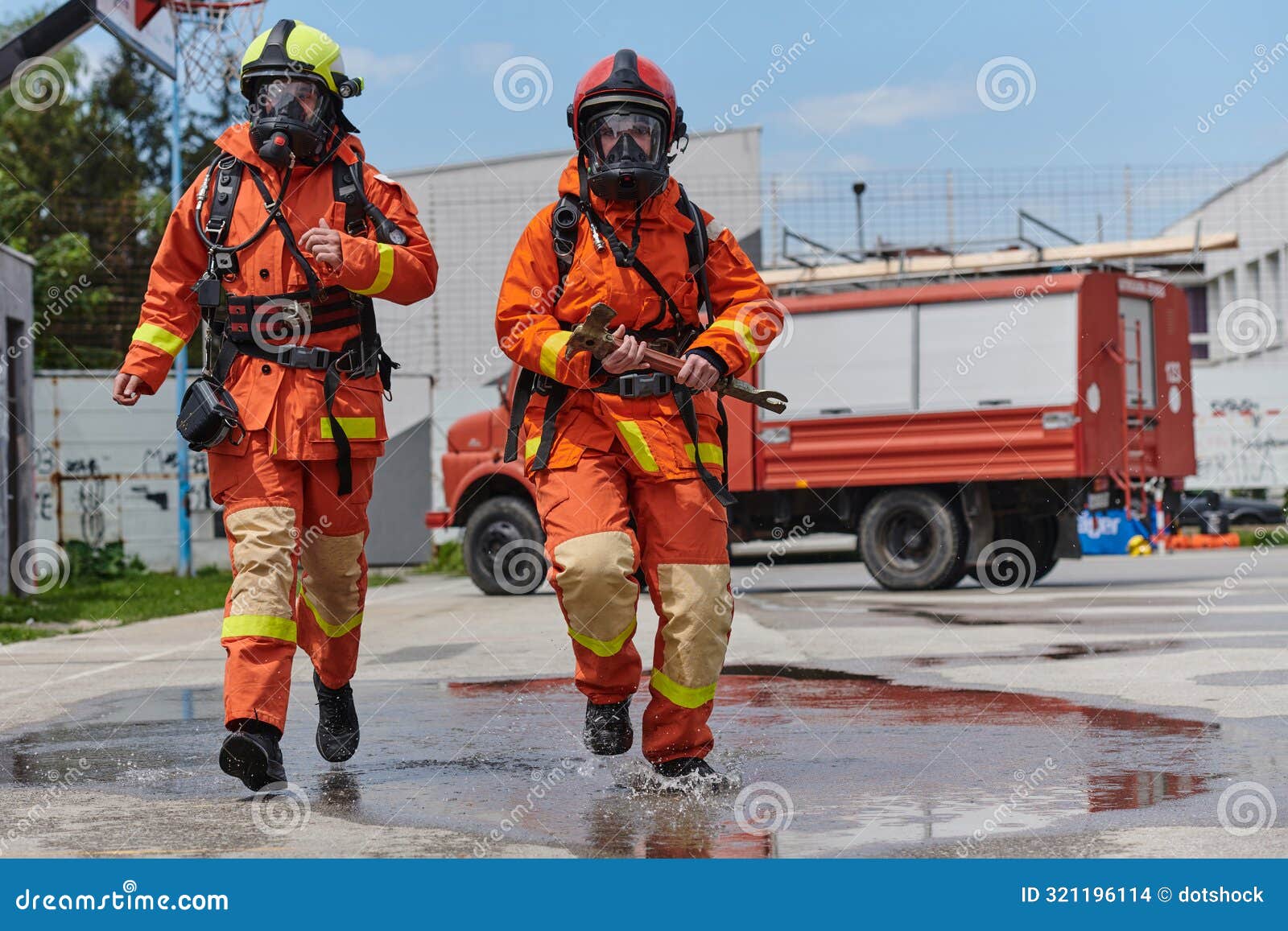 Firefighter Team Training with Various Tools in Professional Gear Stock ...