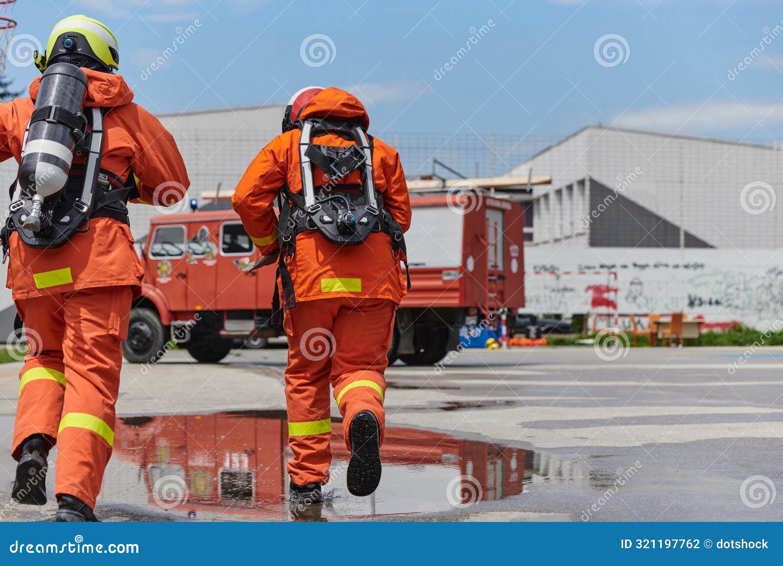 Firefighter Team Training with Various Tools in Professional Gear Stock ...