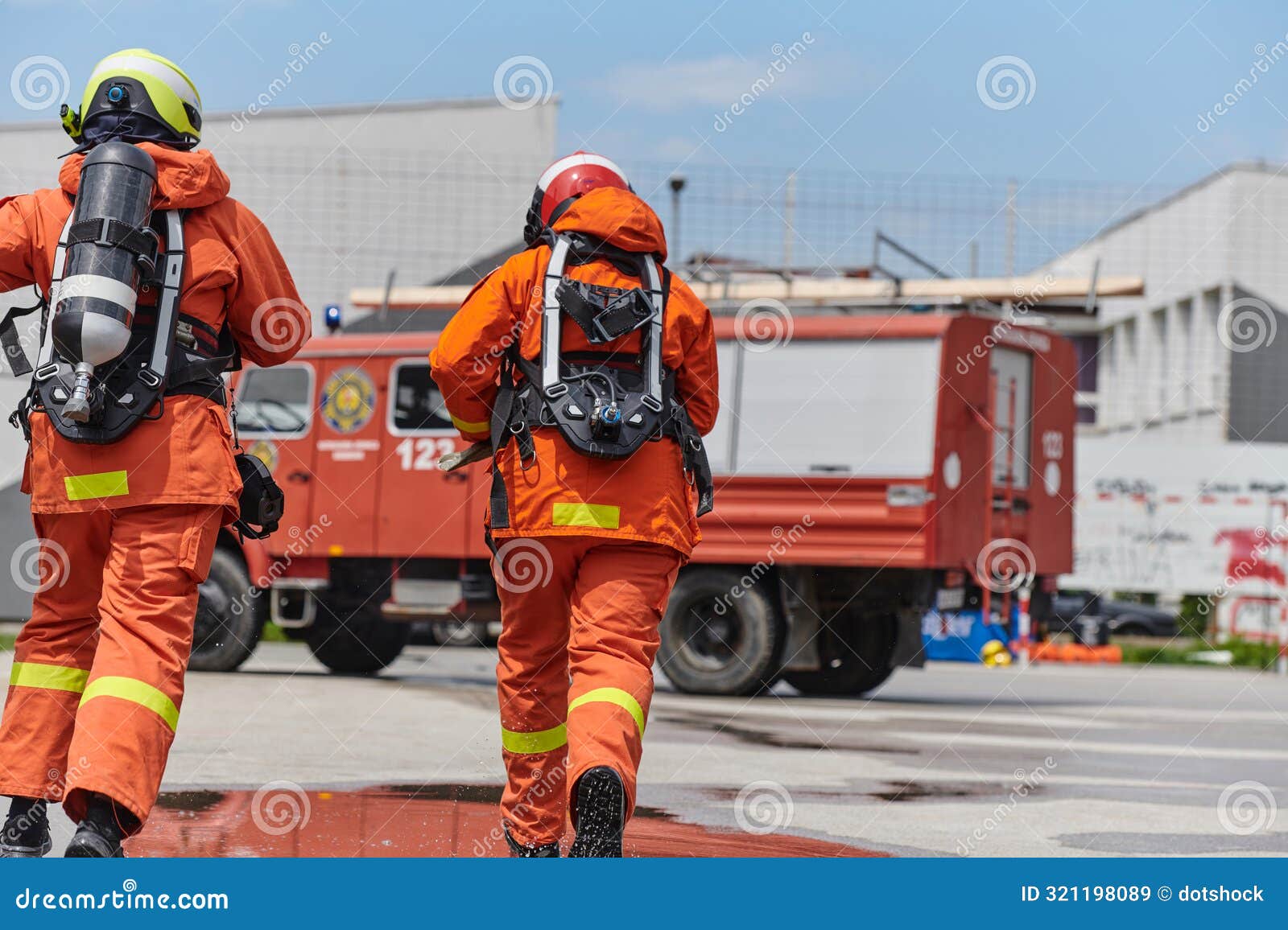 Firefighter Team Training with Various Tools in Professional Gear Stock ...