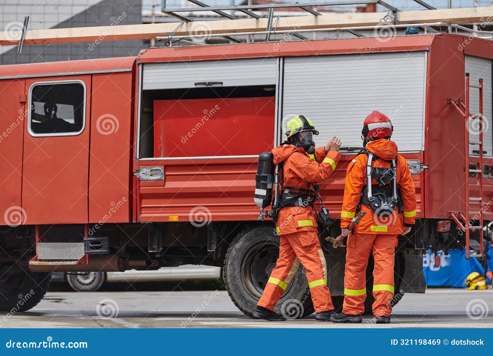 Firefighter Team Training with Various Tools in Professional Gear Stock ...