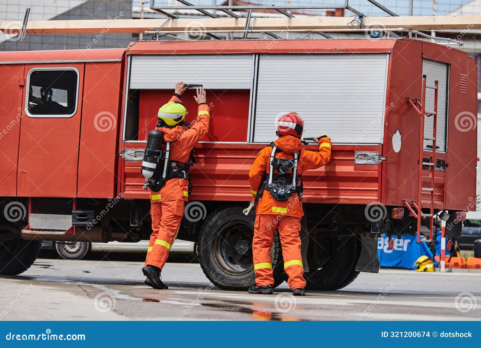 Firefighter Team Training with Various Tools in Professional Gear Stock ...