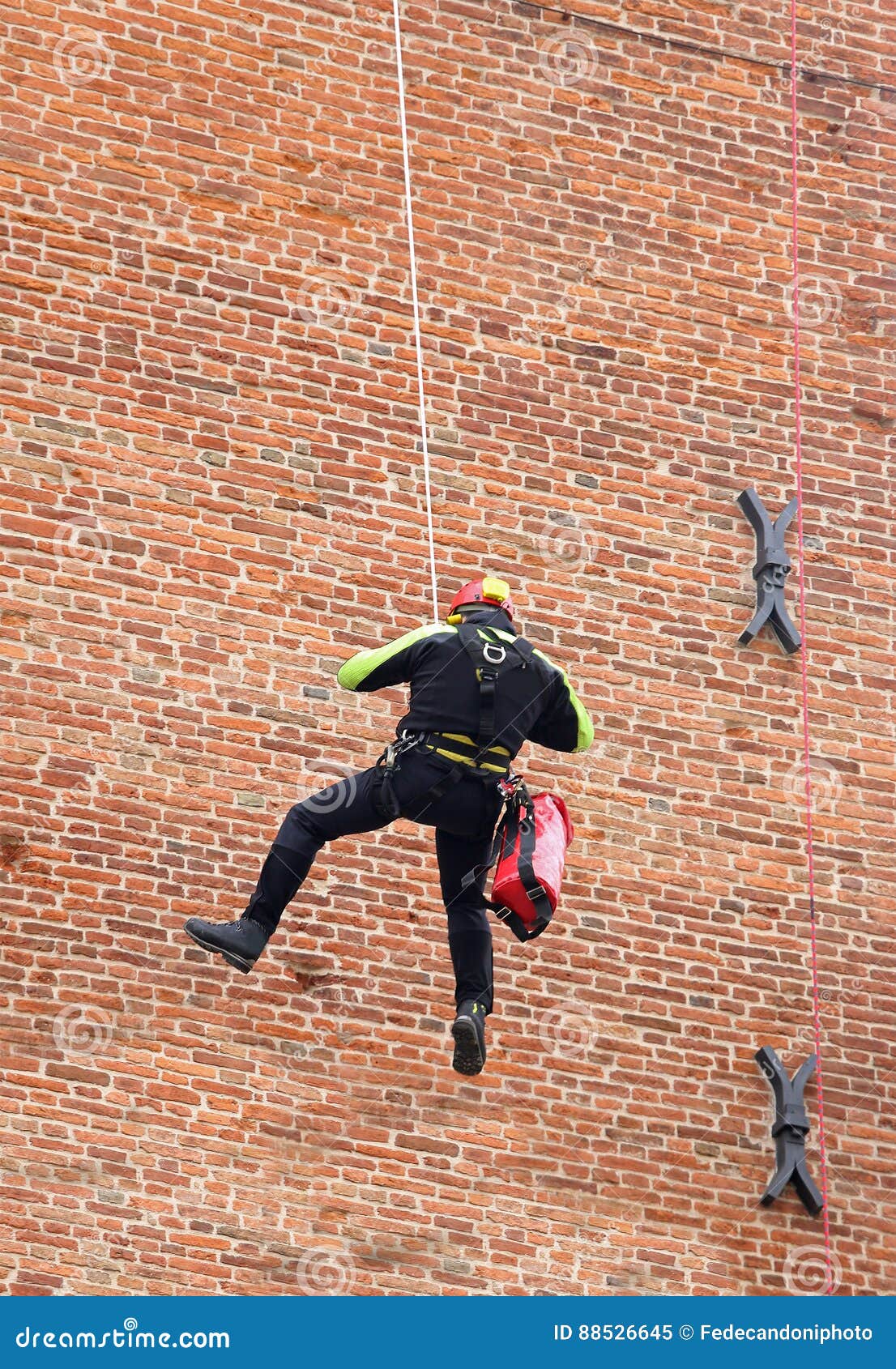 Firefighter during a Training Exercise Climbing on Old Brick Med ...