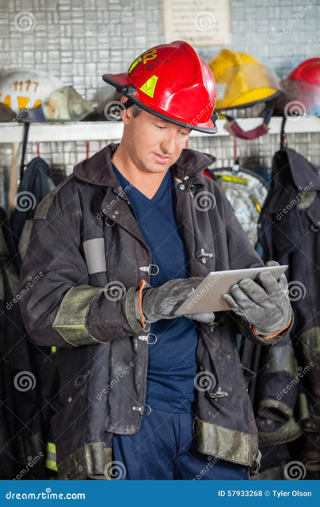 Firefighter Using Digital Tablet at Fire Station Stock Photo - Image of ...