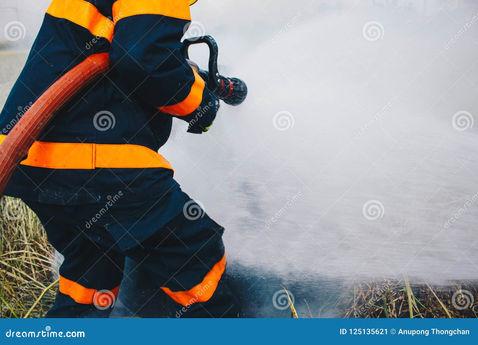 Firefighter Using Fire Extinguisher and Fire Extinguisher Stock Image ...