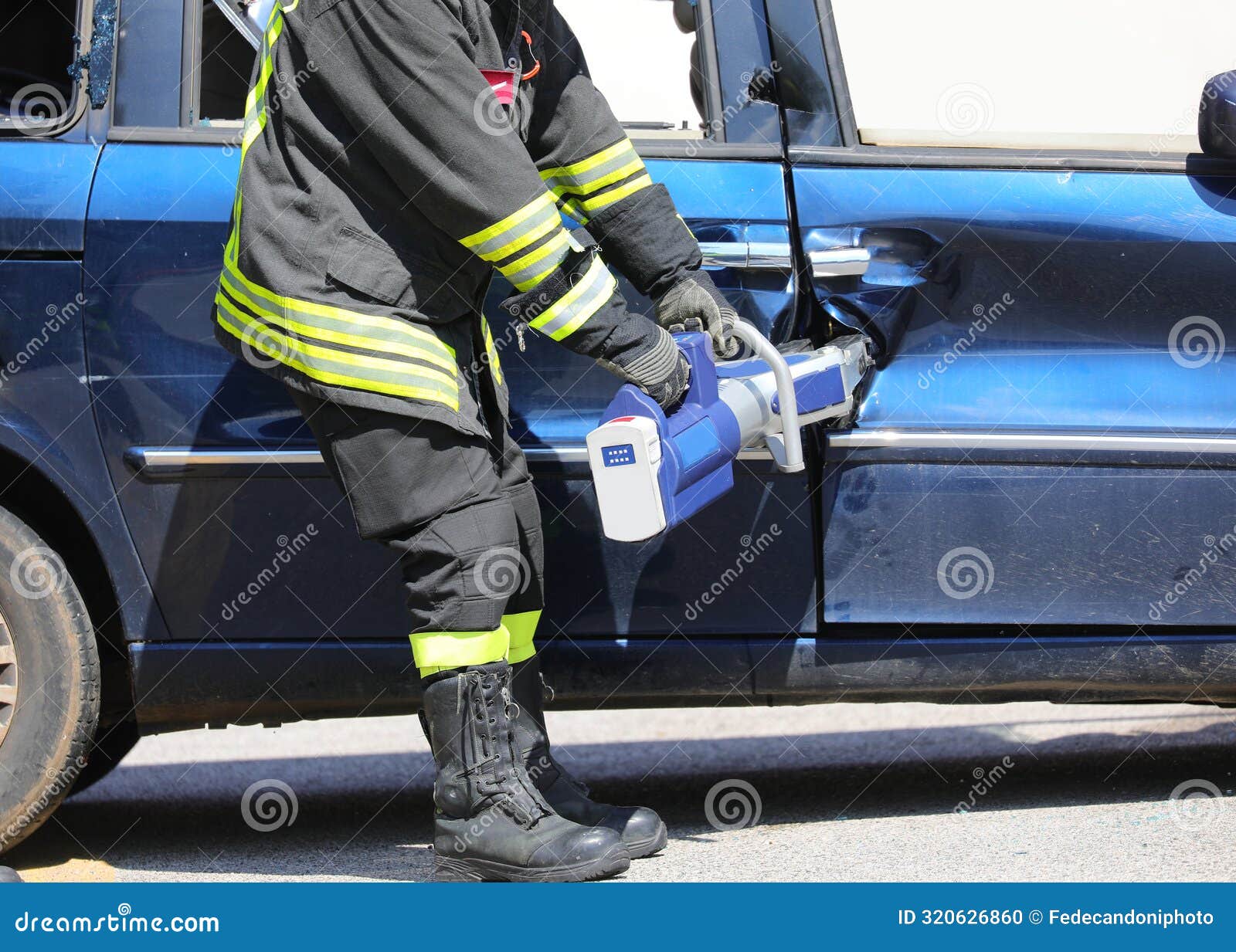 Firefighter Using Powerful Cordless Pneumatic Shears To Open the Jammed ...