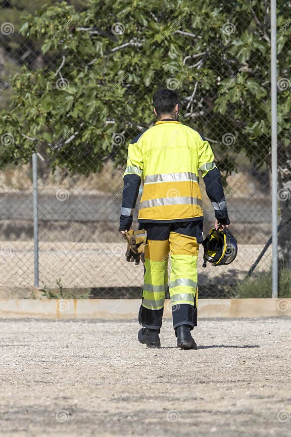 Firefighter Walking Backwards in Uniform Stock Photo - Image of outside ...