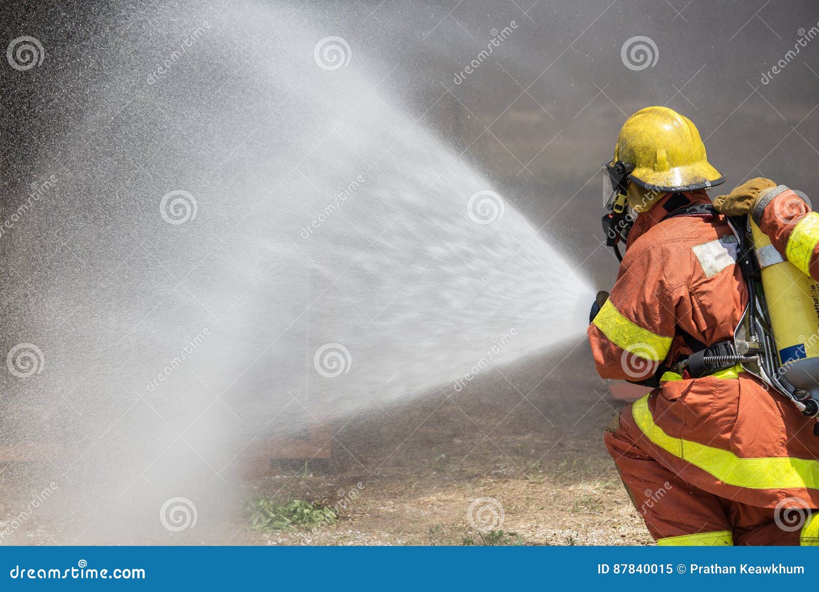 Firefighter Water Spray by High Pressure Fire Hose Stock Image - Image ...