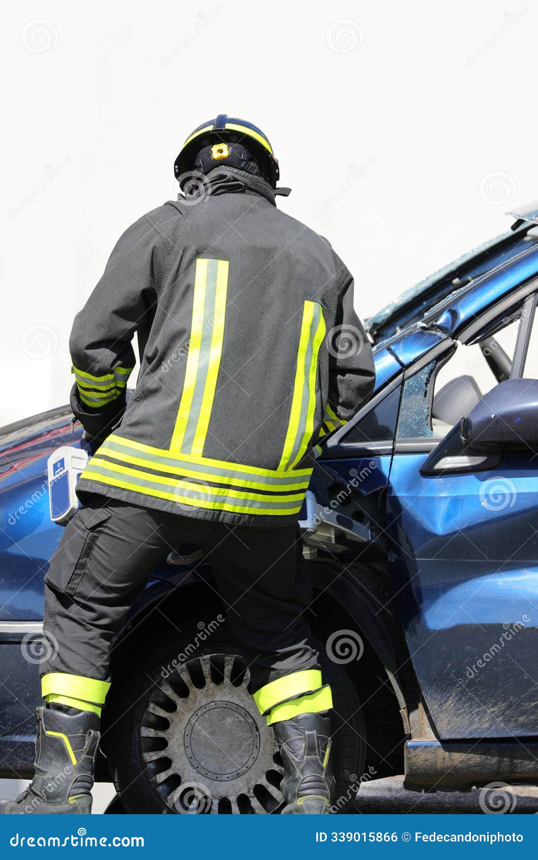 Firefighter Wearing a Uniform is Using Hydraulic Shears Stock Photo ...