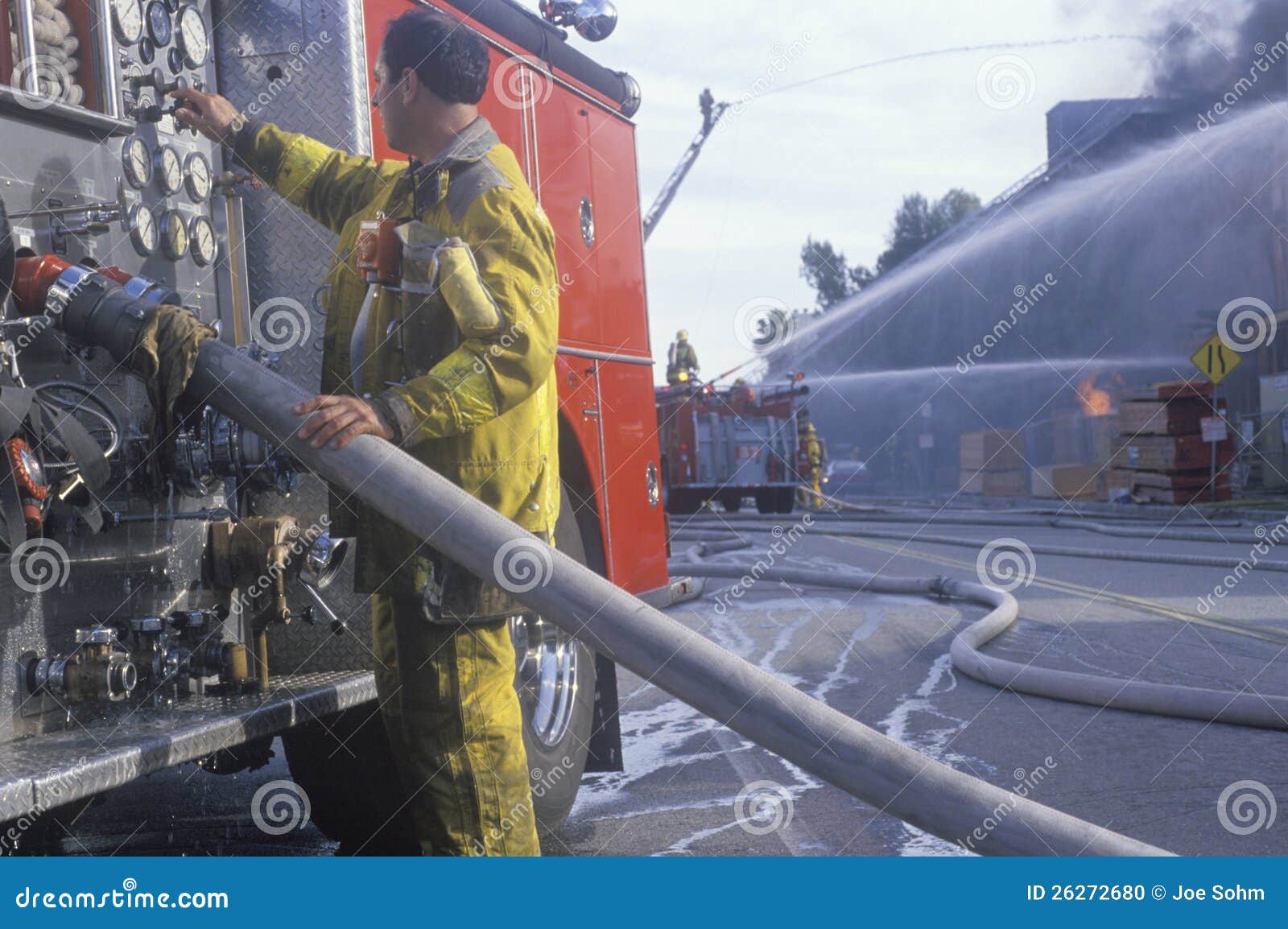 Firefighter Working with Fire Hose Editorial Image - Image of firemen ...
