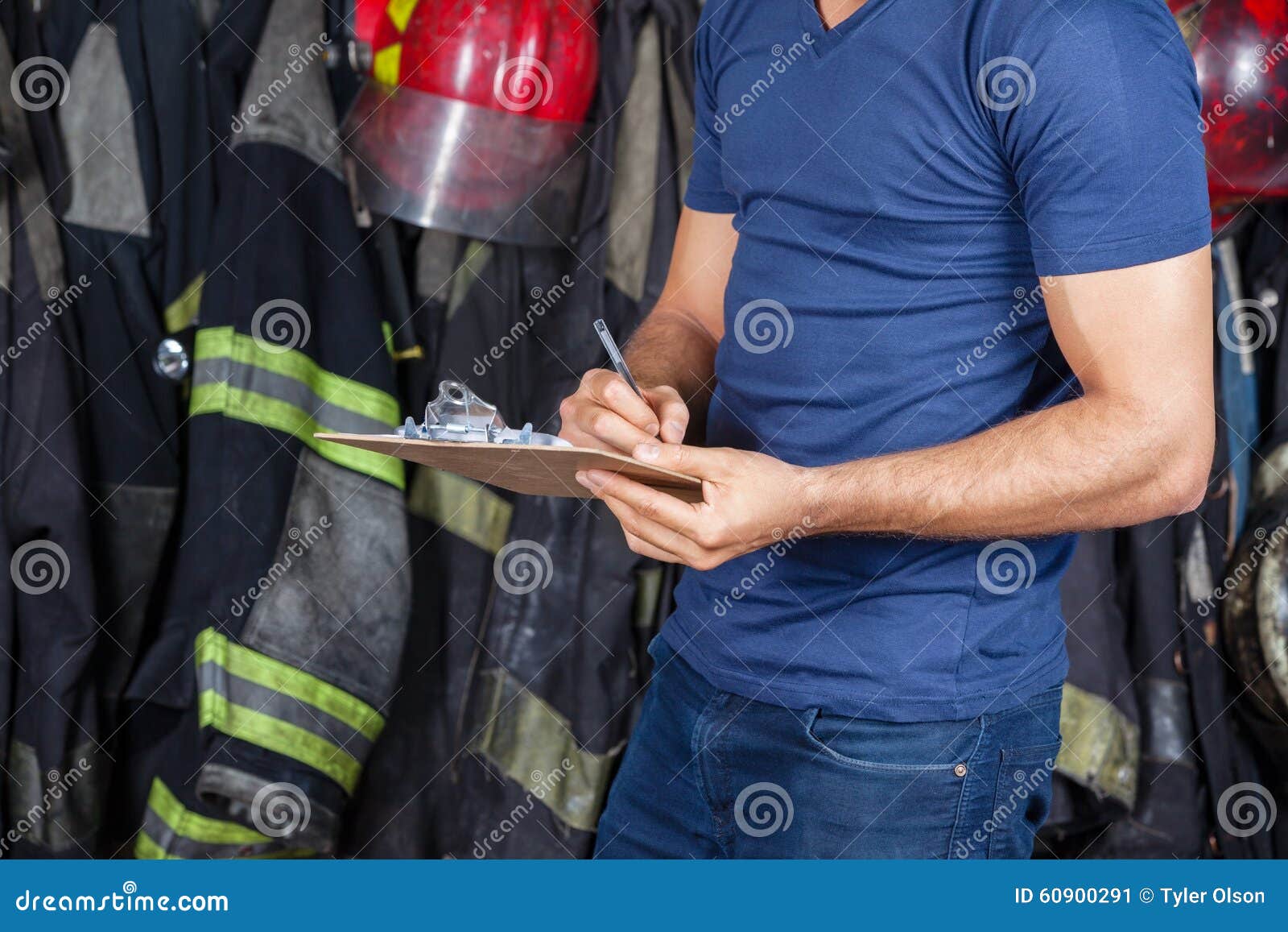 Firefighter Writing on Clipboard Stock Image - Image of fireman ...