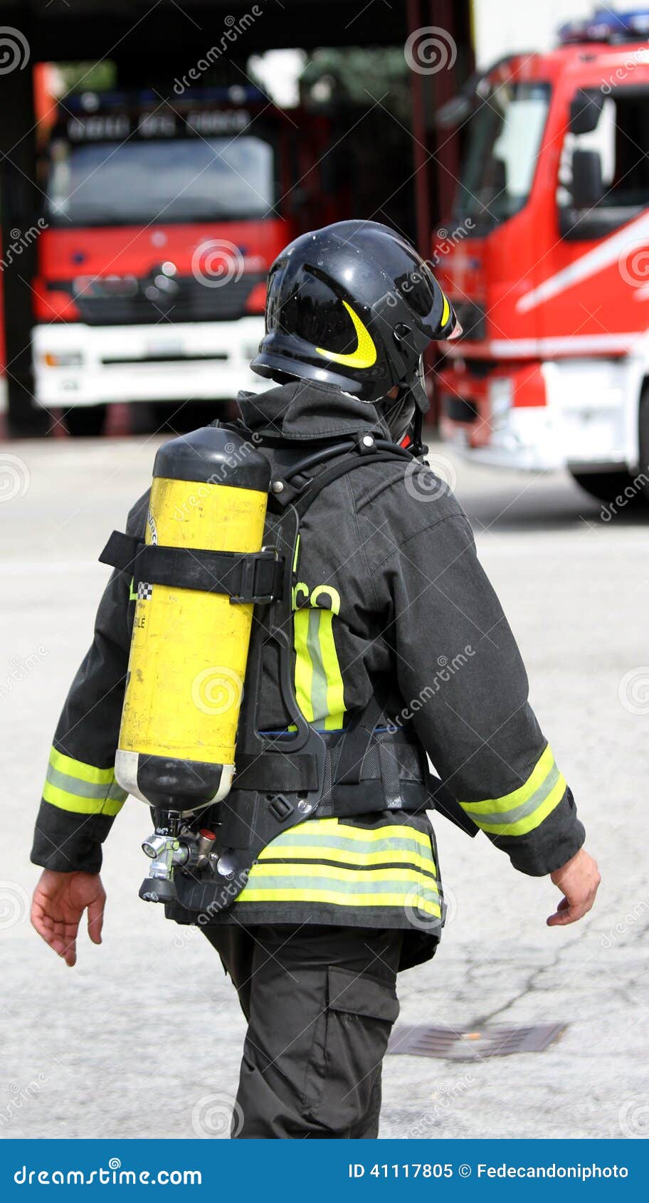 Firefighter with Yellow Oxygen Cylinder and the Helmet Stock Image ...