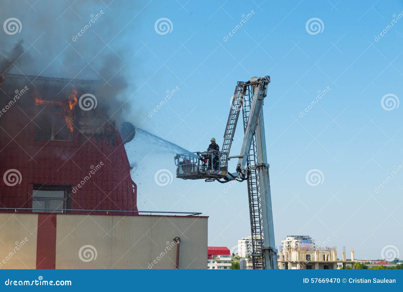 Firefighters in action editorial image. Image of building - 57669470