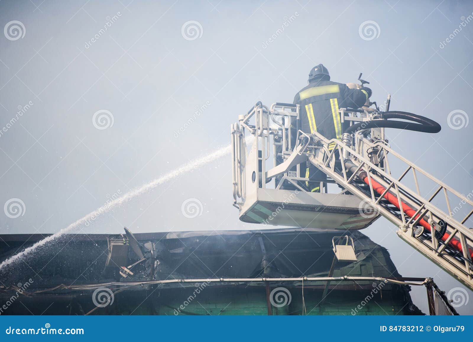 Firefighters in Action Fighting, Extinguishing Fire, in Smoke. Stock ...