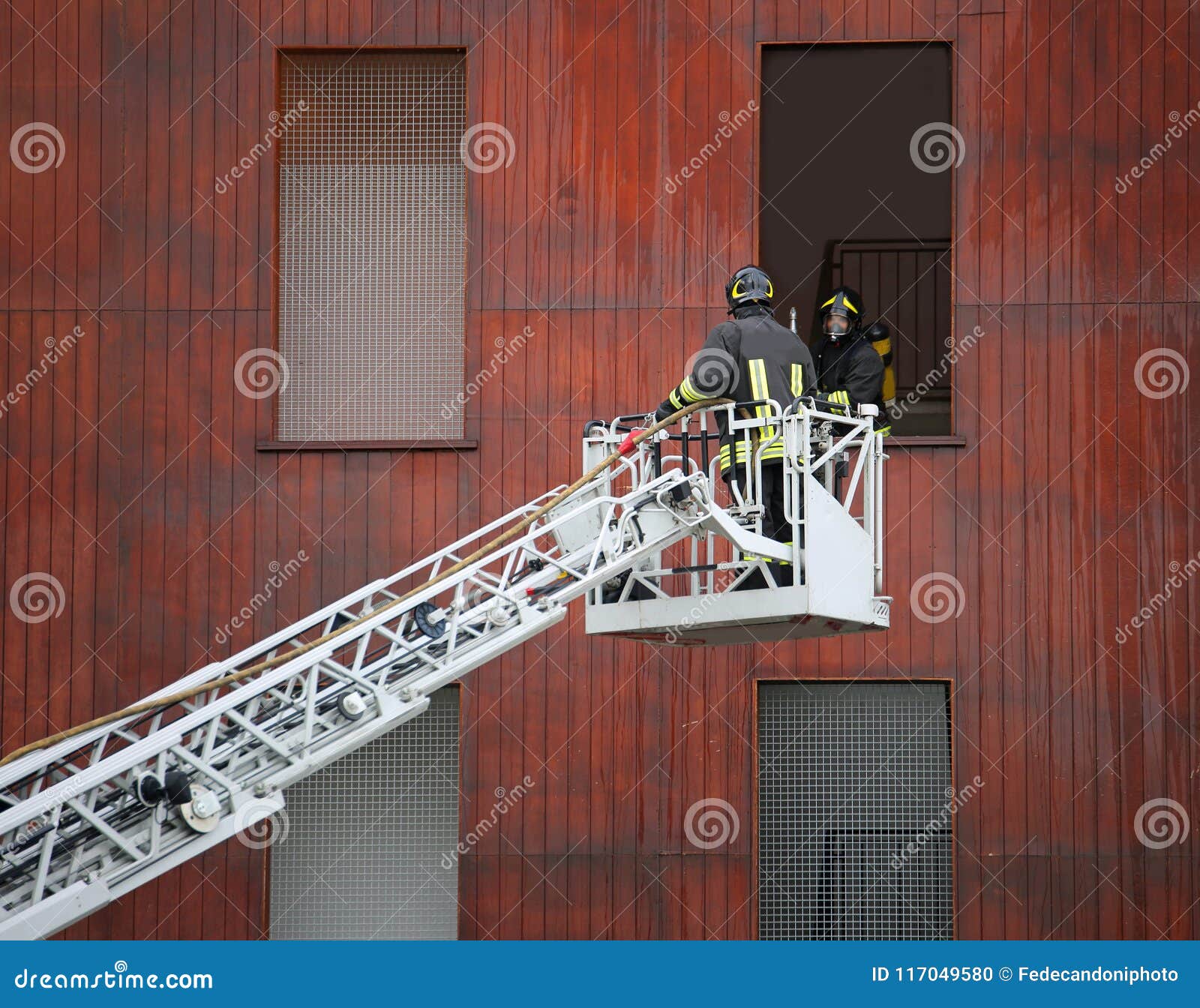 Firefighters in Action during a Practice at Fire House Stock Photo ...