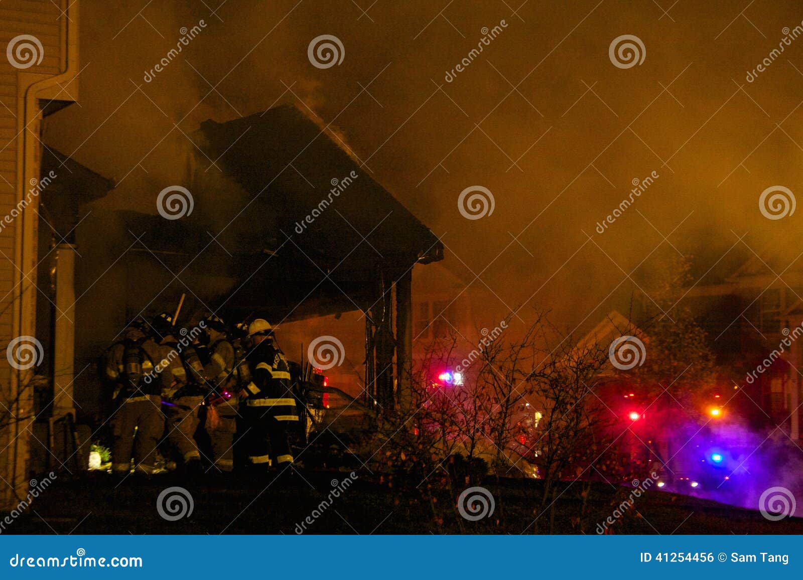 Firefighters Breaking into a Burning House Stock Photo - Image of burn ...