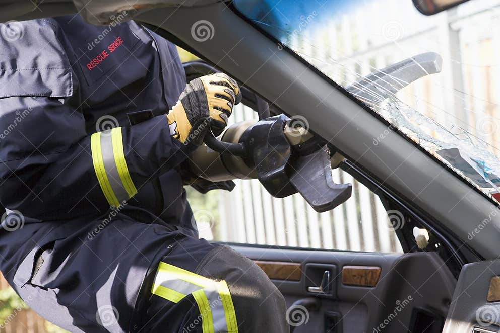 Firefighters Breaking a Car Windscreen Stock Image - Image of jaws ...