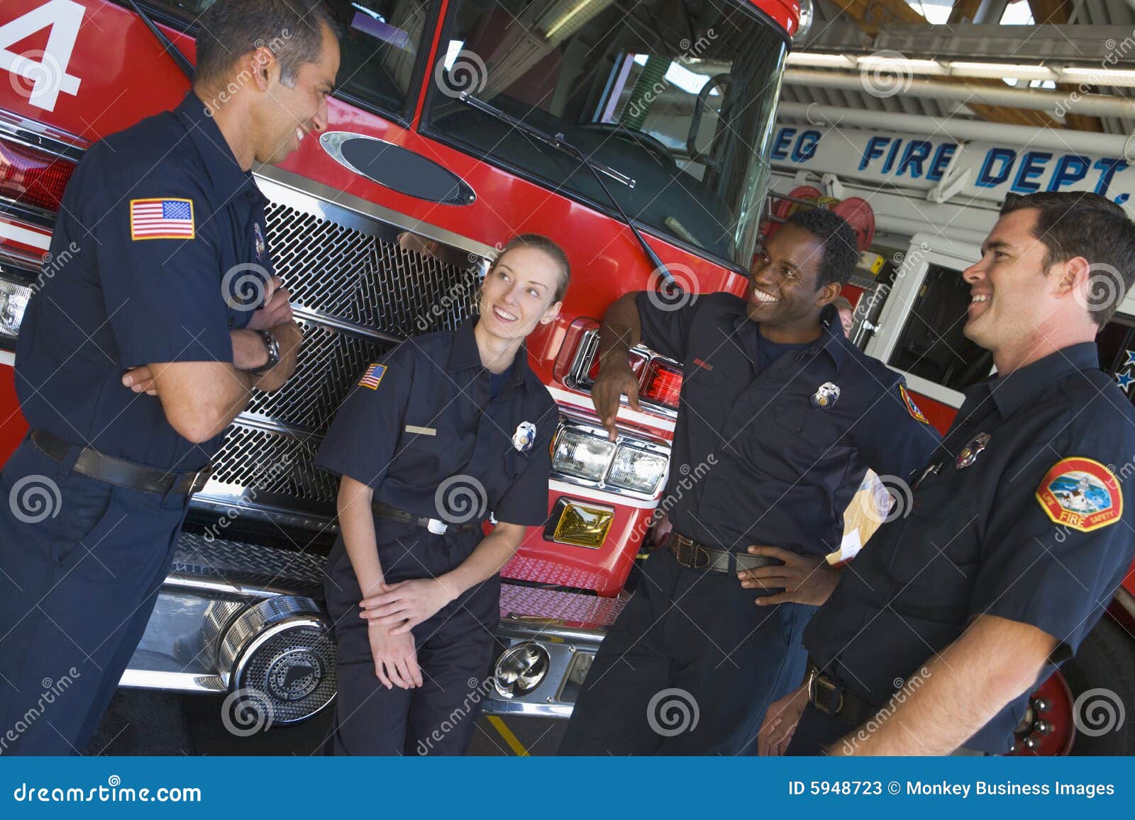 Firefighters Chatting by a Fire Engine Stock Image - Image of fighter ...