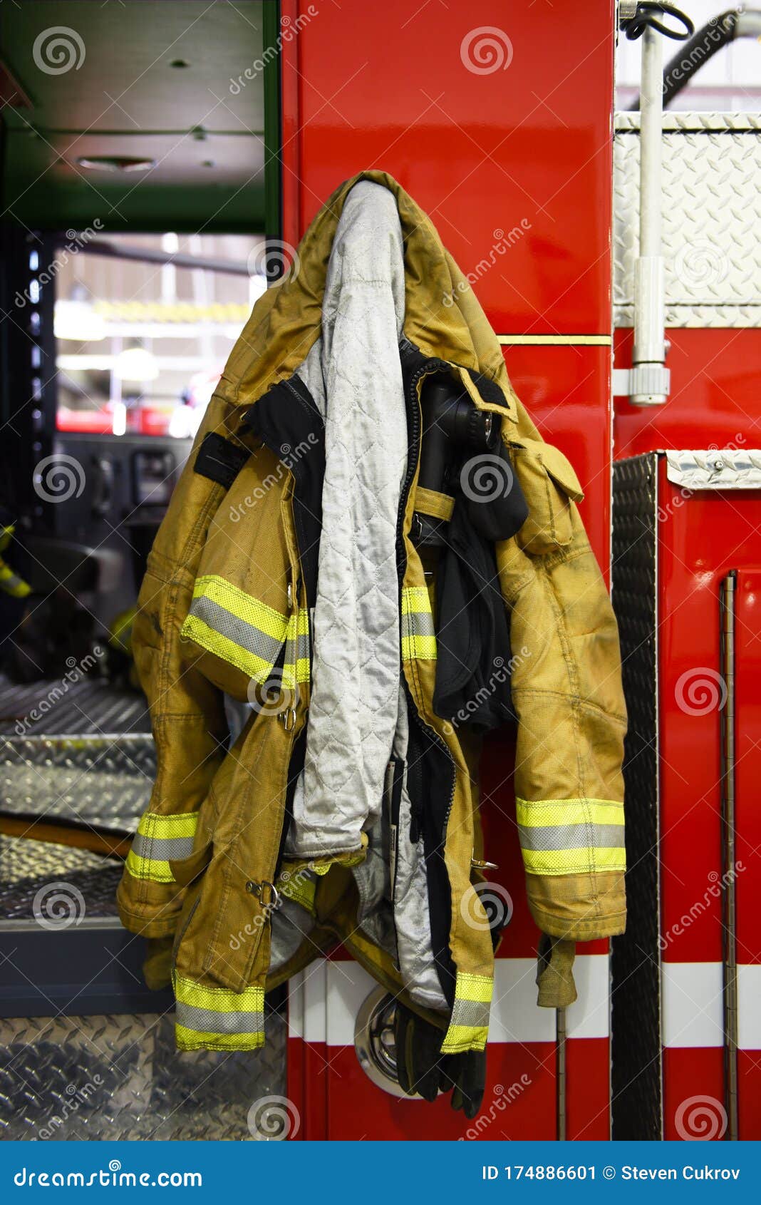 A Firefighters Coat Hanging on the Outside of a Fire Engine Stock Image ...
