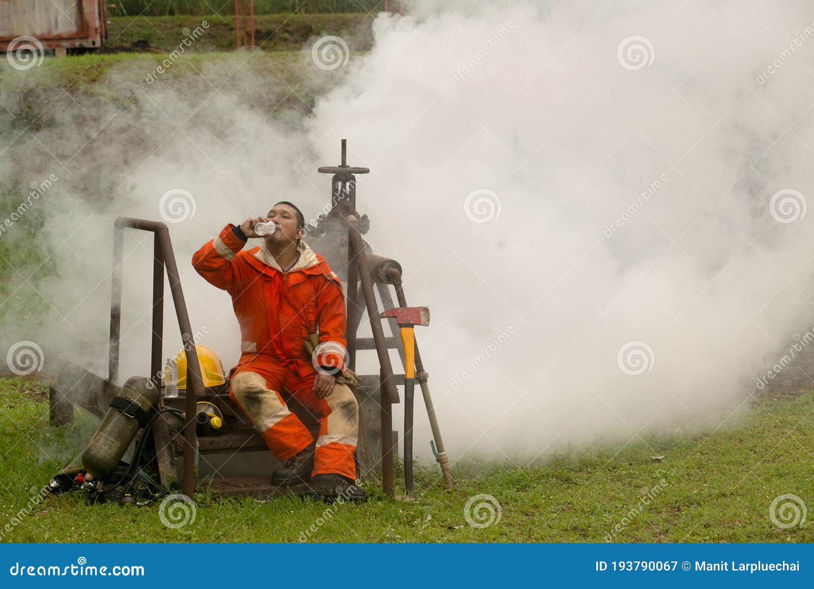 The Firefighters Drink Water while Resting. after the Fire that Burned ...
