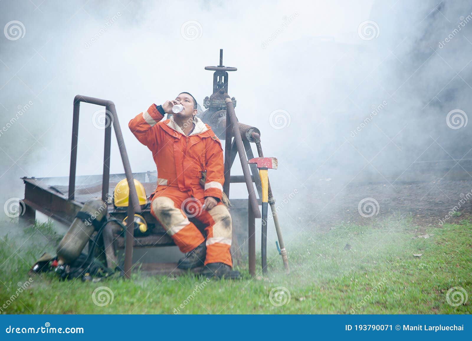 The Firefighters Drink Water while Resting. after the Fire that Burned ...