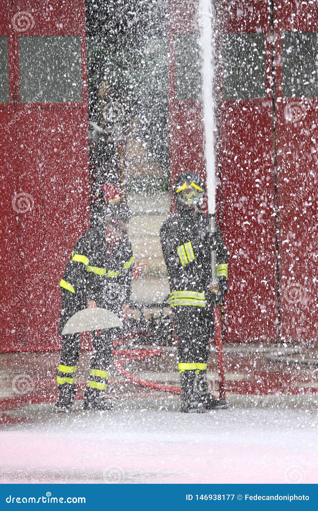Firefighters during an Exercise in the Fire Station and the Foam Stock ...