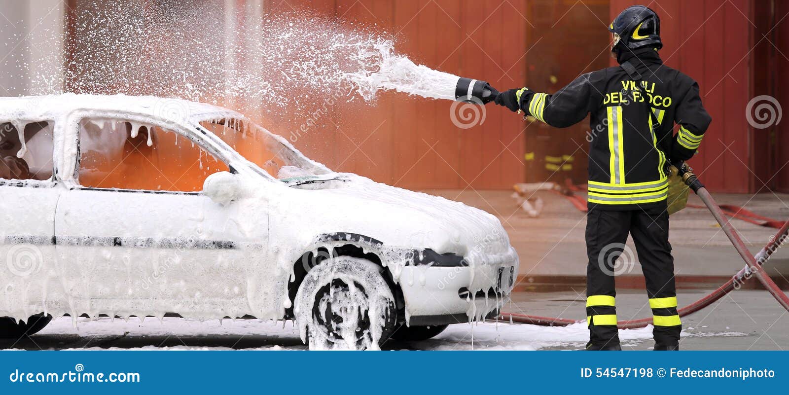 Firefighters during Exercise To Extinguish a Fire in a Car Stock Photo ...