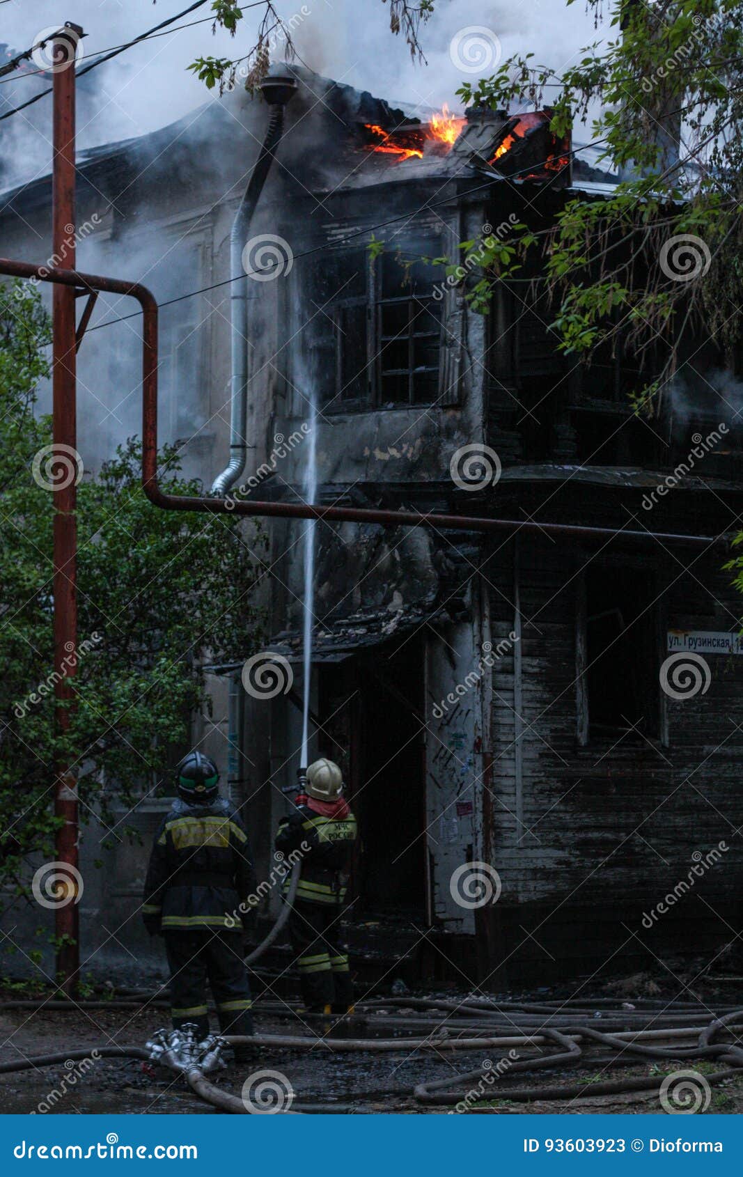Firefighters Extinguish a Fire in an Old House Stock Image - Image of ...