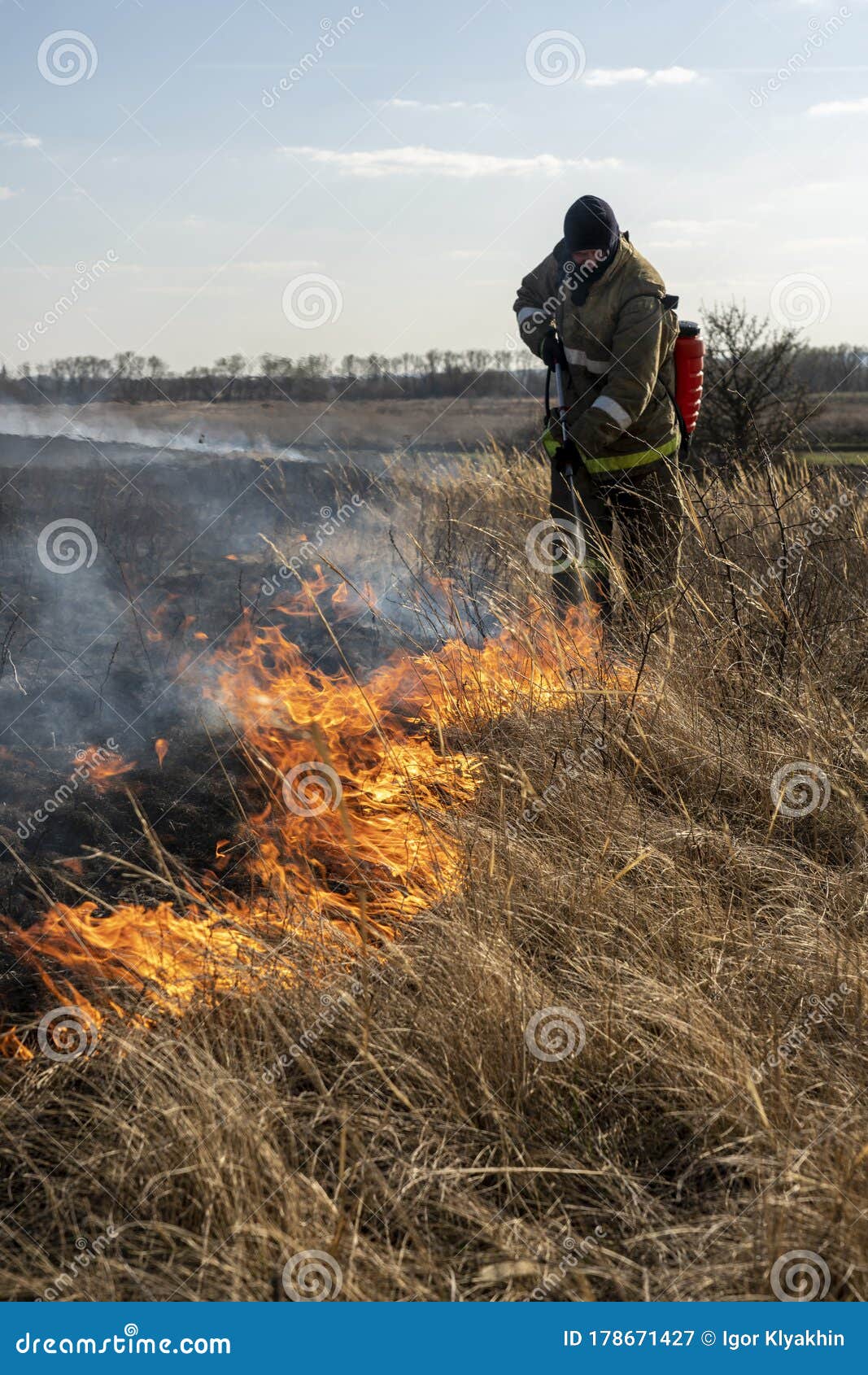 Firefighters Extinguish The Flames Of Burning Grass Stock Image Image