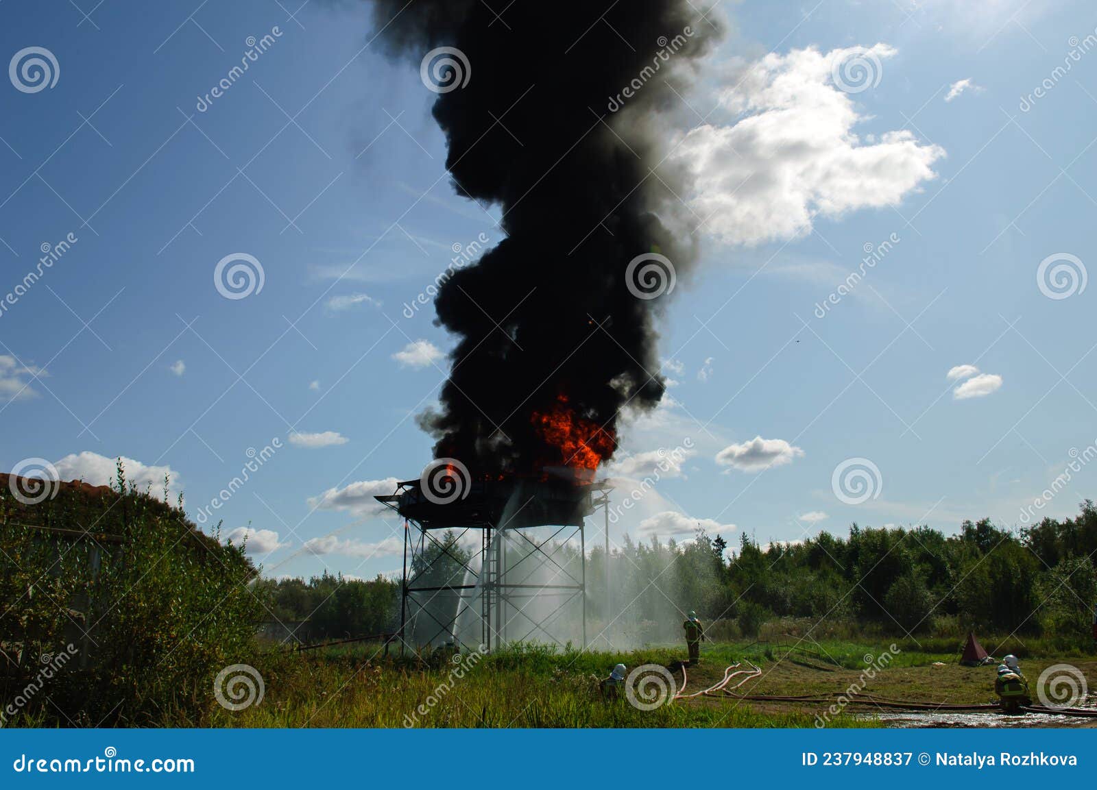 Firefighters Extinguish a Large Fire at the Factory. Stock Image ...