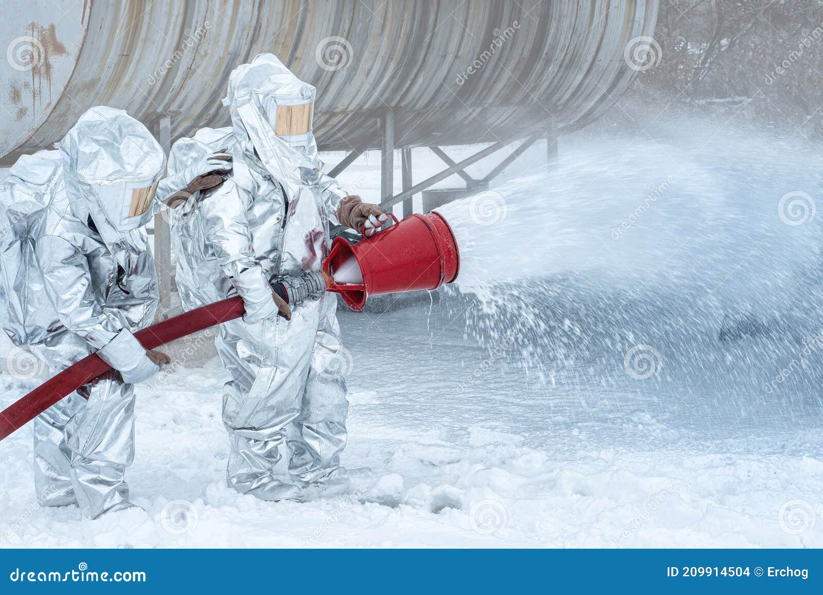 Firefighters in Fire Fighting Operation. Airport Firefighters. Training ...