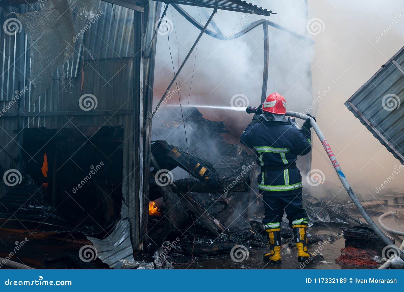 Firefighters on Fire. Fireman Extinguishes the Fire with Water ...