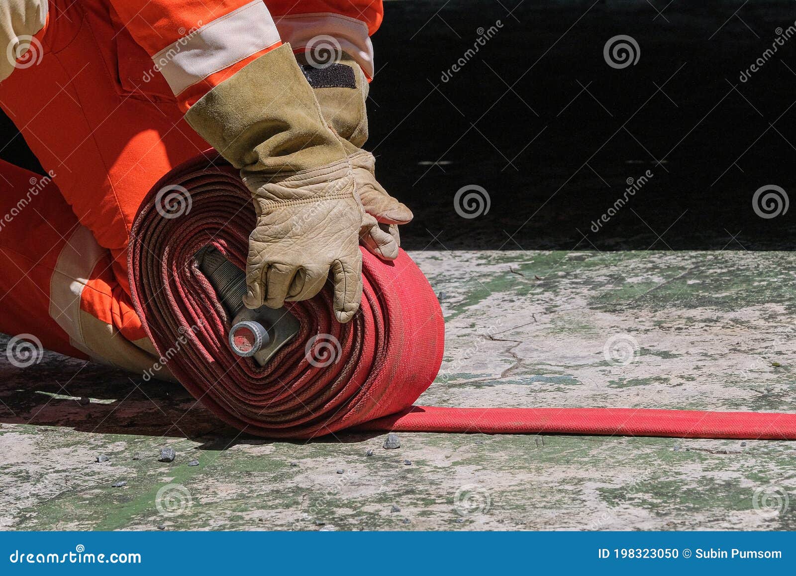 Firefighters and Fire Hose Coil Fire and Rescue Training School ...