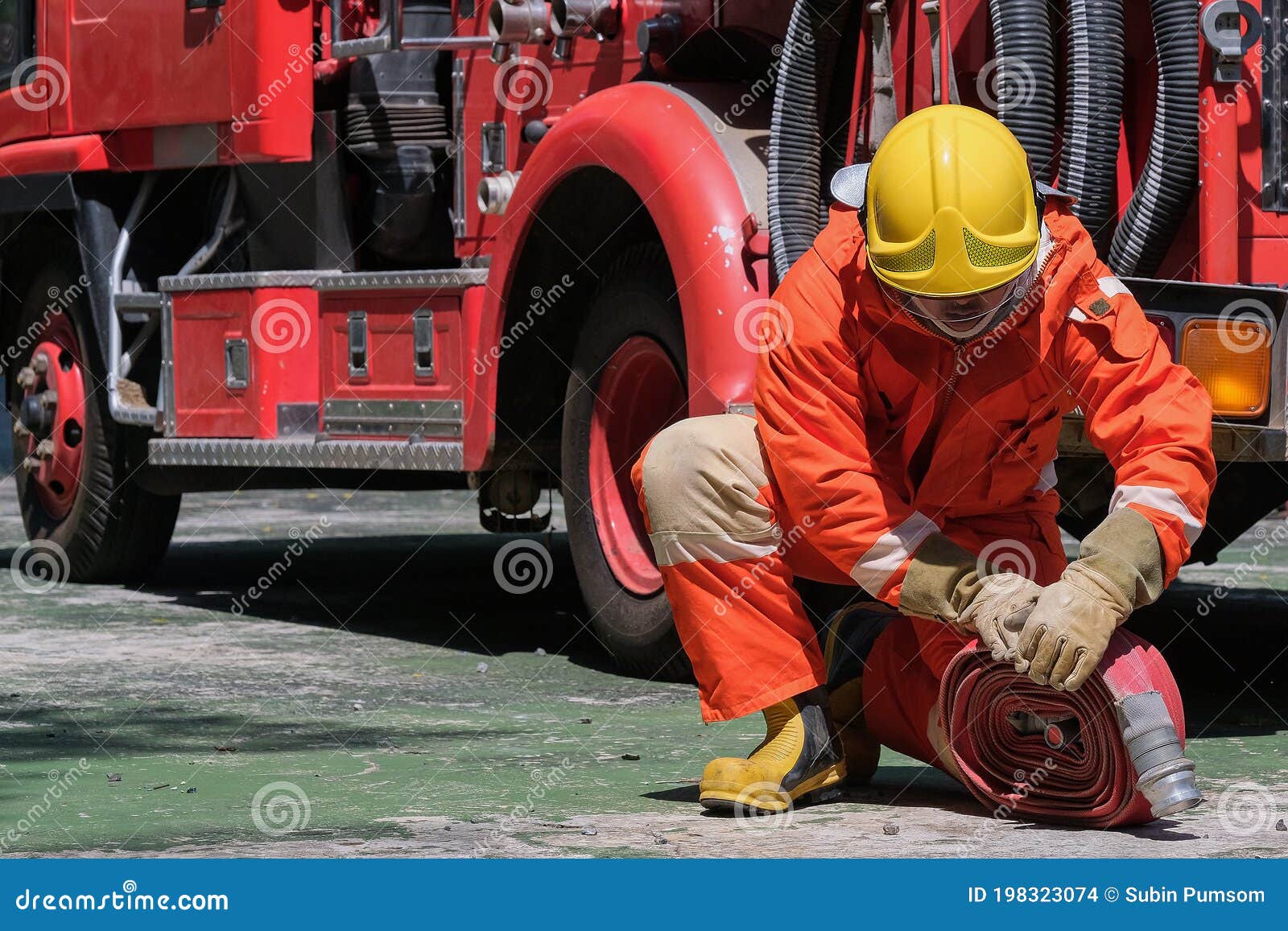 Firefighters and Fire Hose Coil Fire and Rescue Training School ...