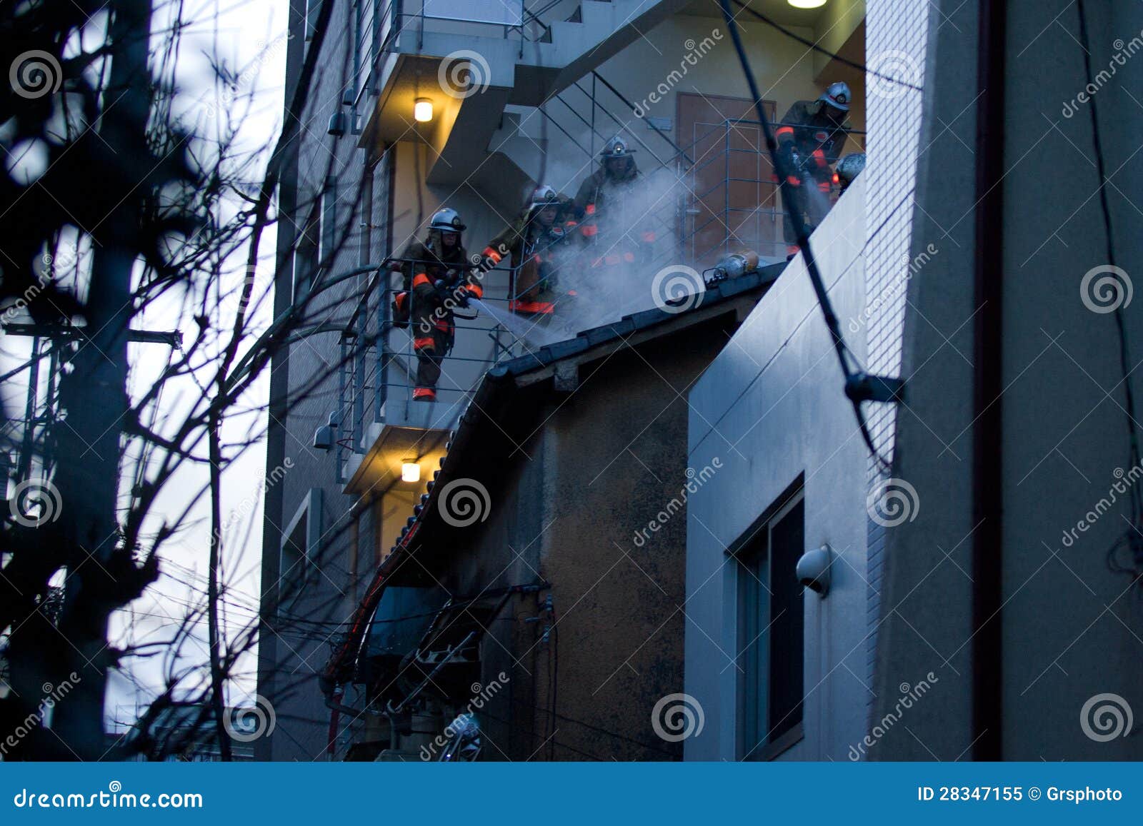 Firefighters fire in Tokyo editorial image. Image of helmet - 28347155