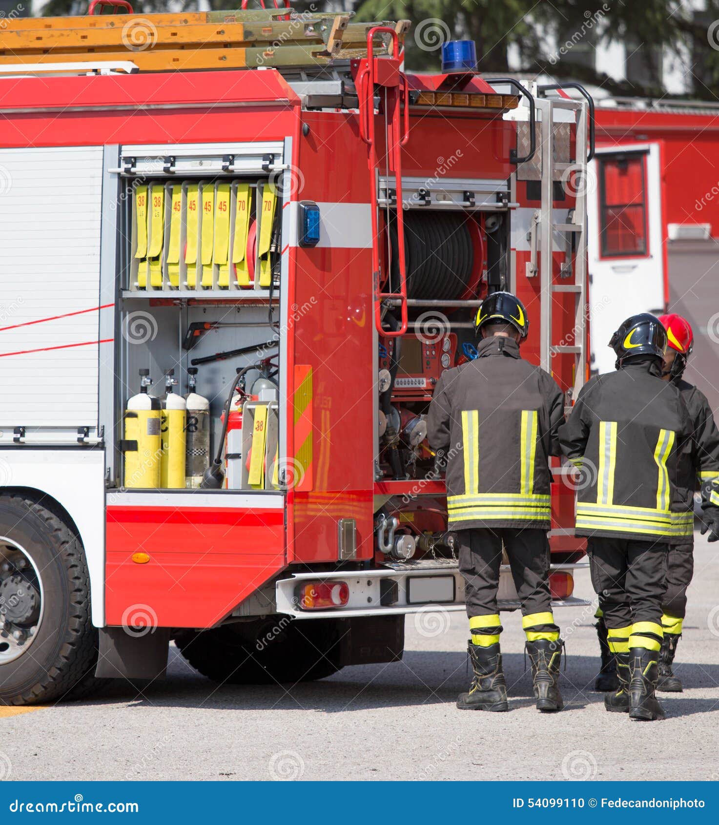 Firefighters and Fire Trucks during an Emergency Stock Photo - Image of ...
