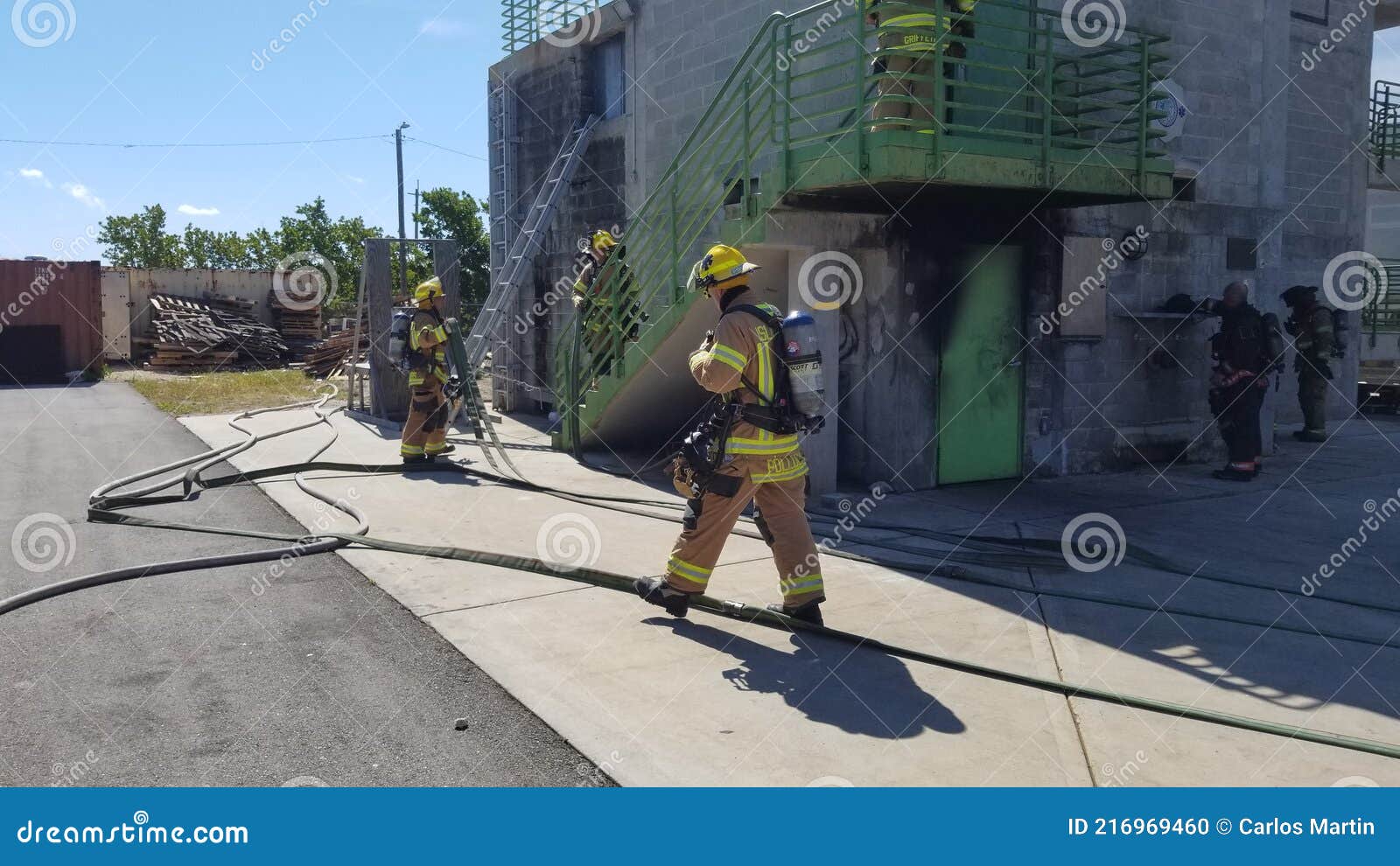 Firefighters hard at work editorial image. Image of city - 216969460