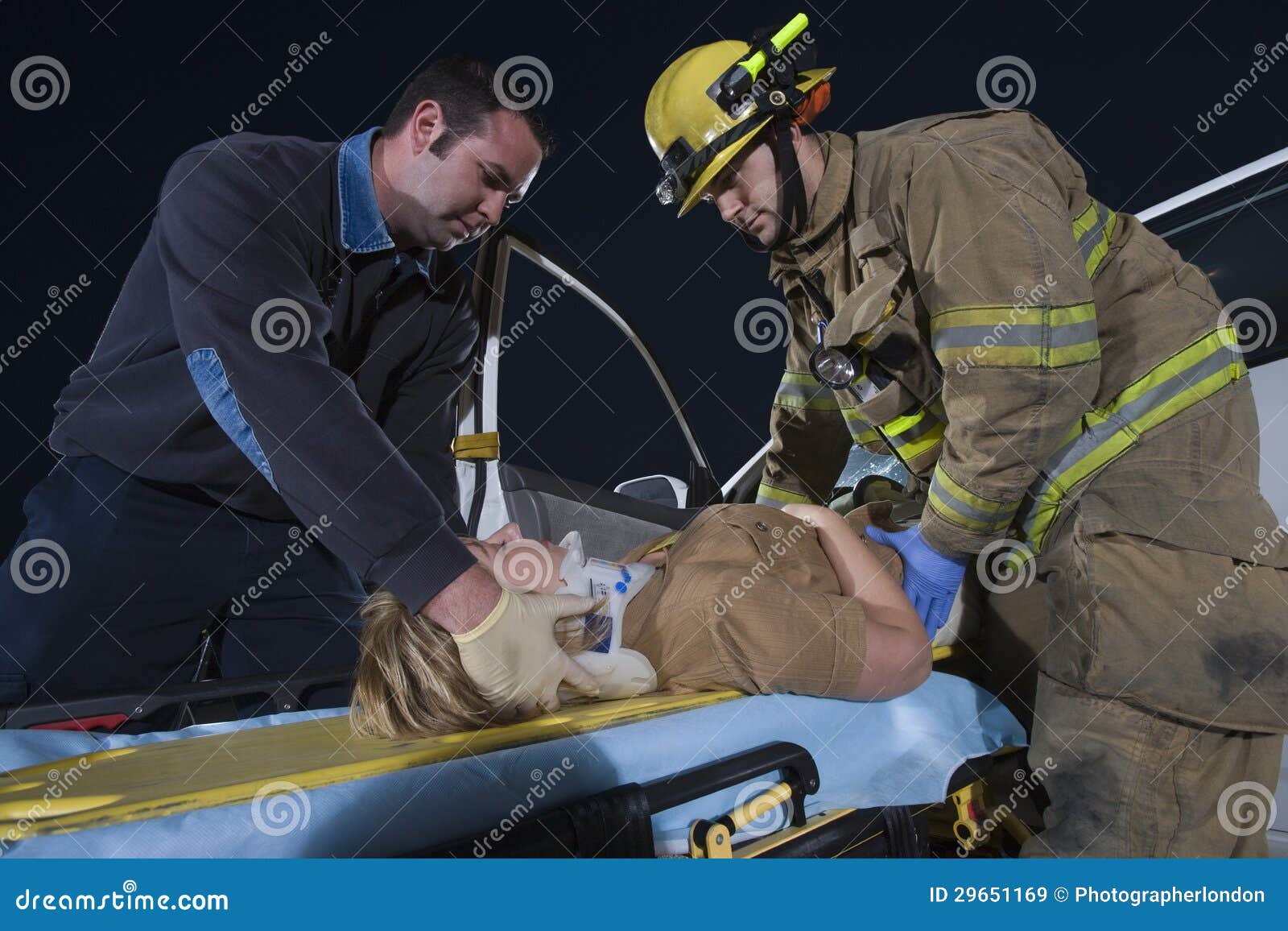 Firefighters Helping an Injured Woman Stock Image - Image of helmet ...