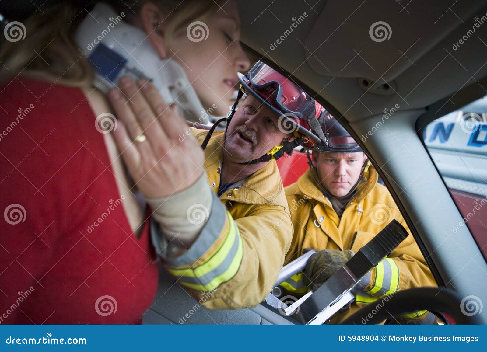 Firefighters Helping an Injured Woman in a Car Stock Photo - Image of ...