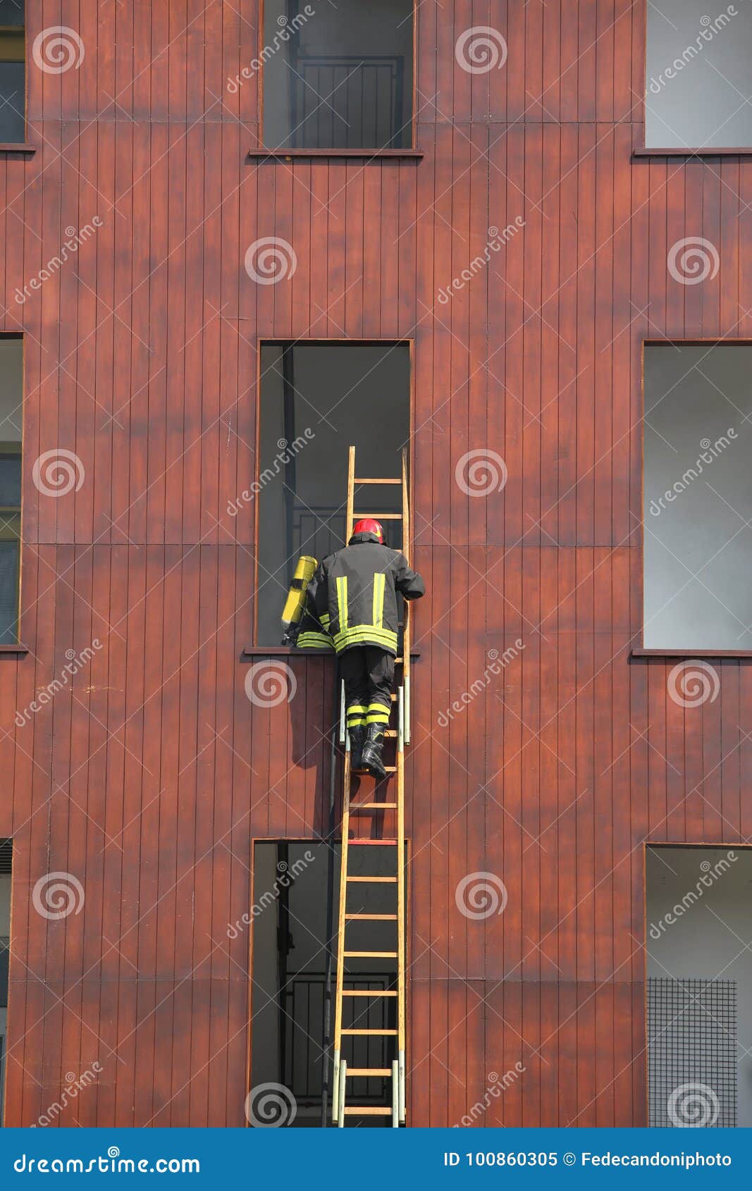 Firefighters during a Ladder Exercise and the Fire Brigade Build Stock ...