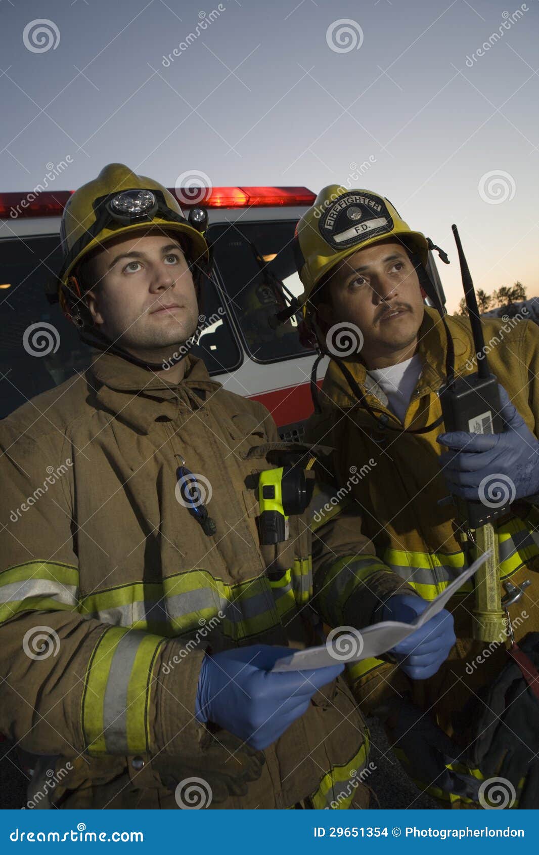 Firefighters Looking Away stock photo. Image of holding - 29651354