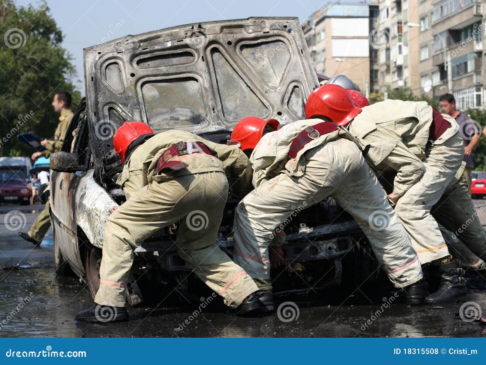 Firefighters moving a car editorial stock photo. Image of danger - 18315508