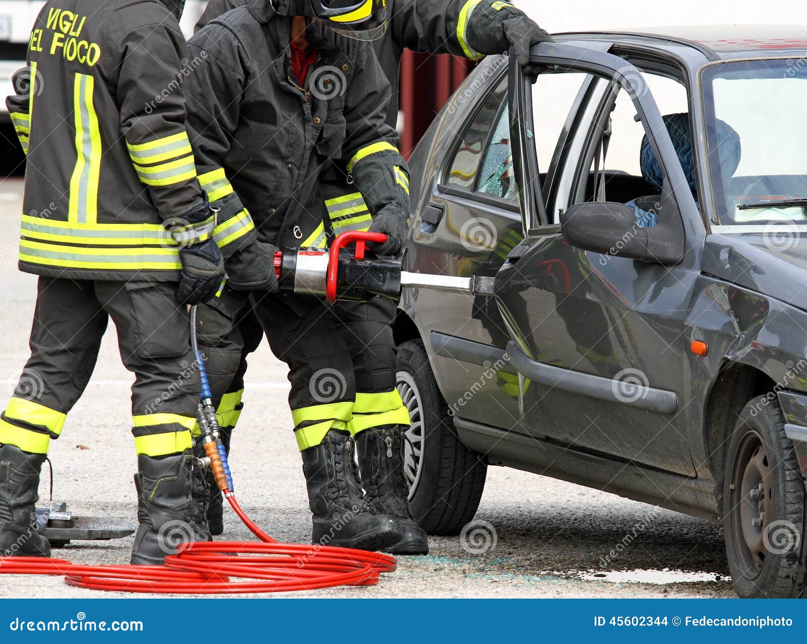 Firefighters Open the Door with a Powerful Pneumatic Shears Stock Photo ...