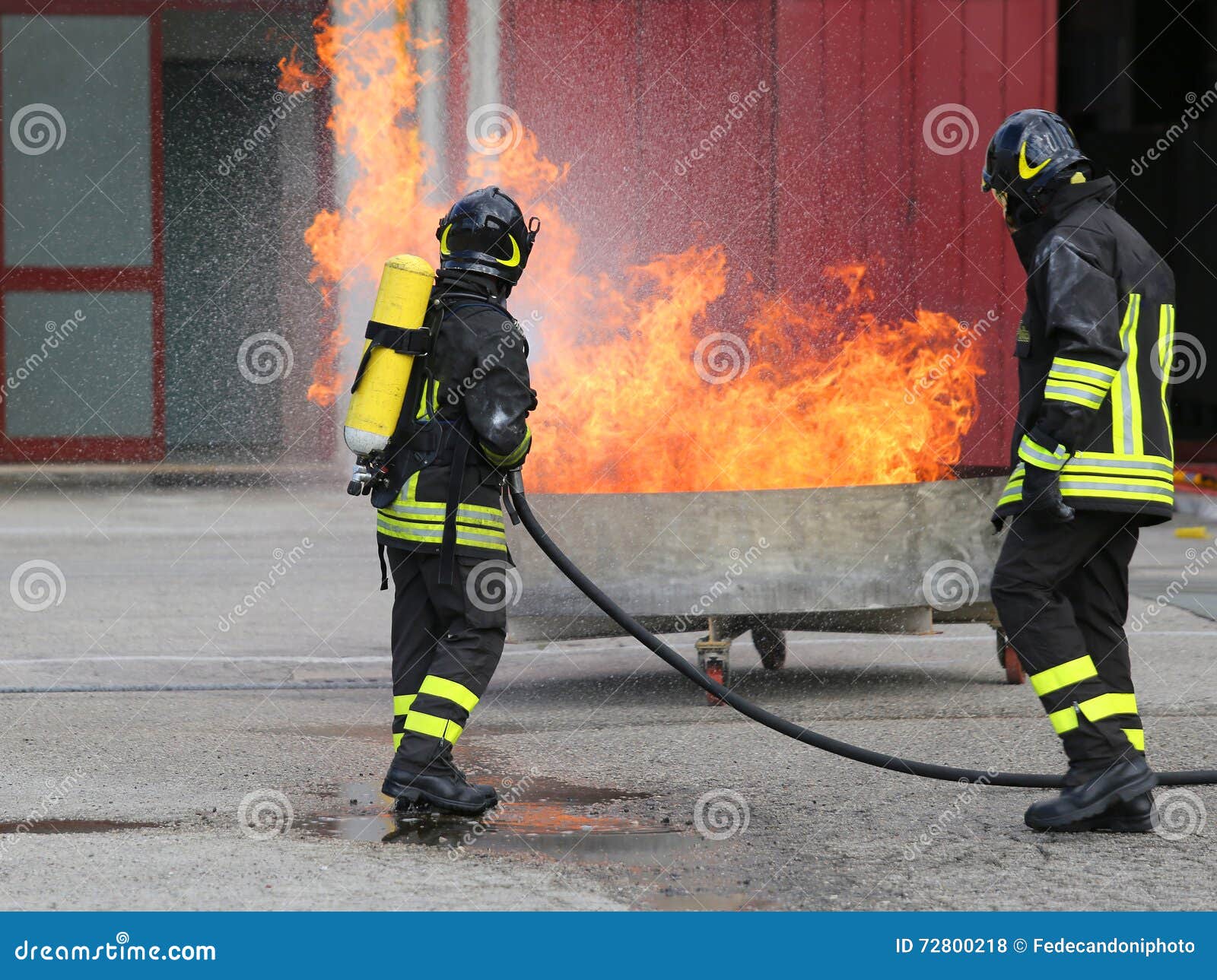 Firefighters with Oxygen Bottles Off the Fire during a Training Stock ...