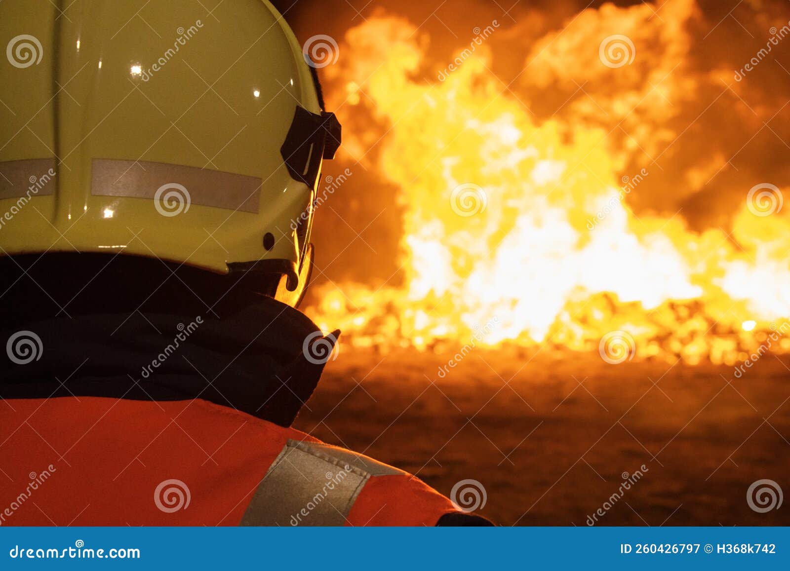 Firefighters Putting Out a Fire. Destruction and Disaster Stock Image ...