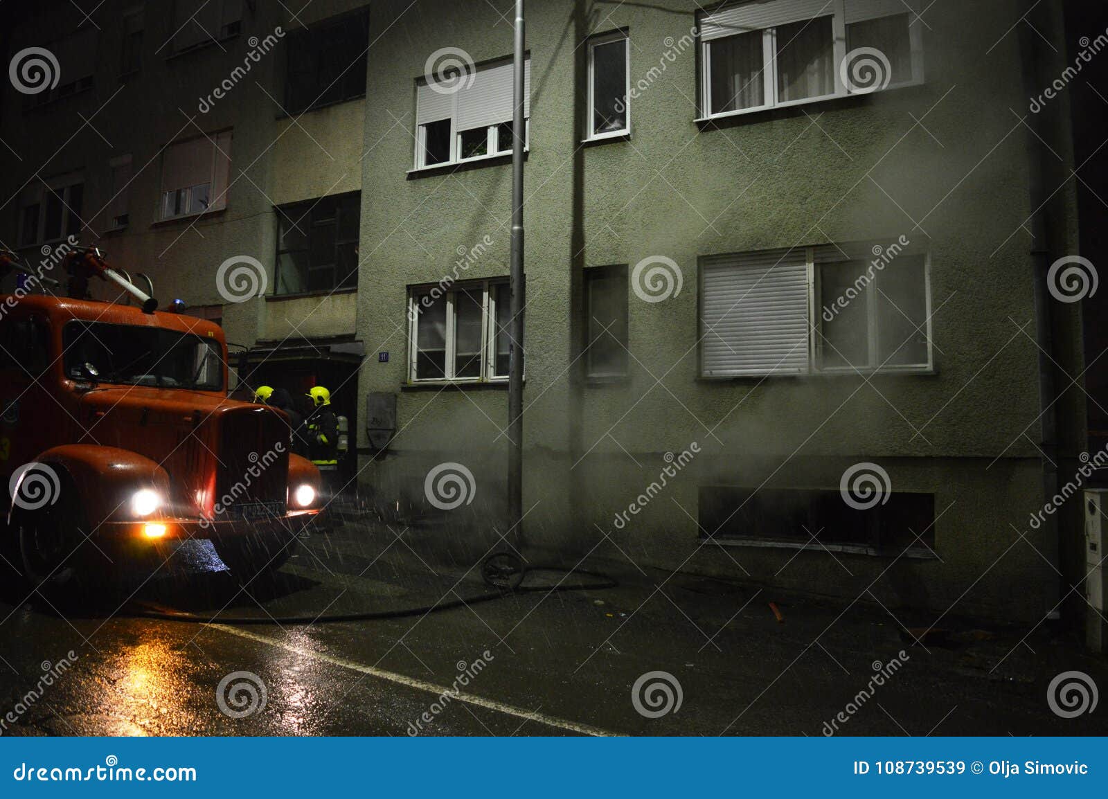 Fire in the building editorial stock image. Image of truck - 108739539