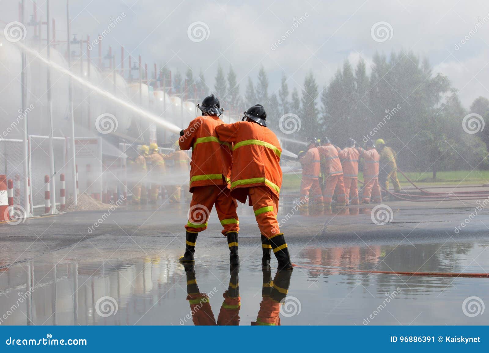 Firefighters Spray Water in Fire Extinguishers Caused by Explosive Gas ...