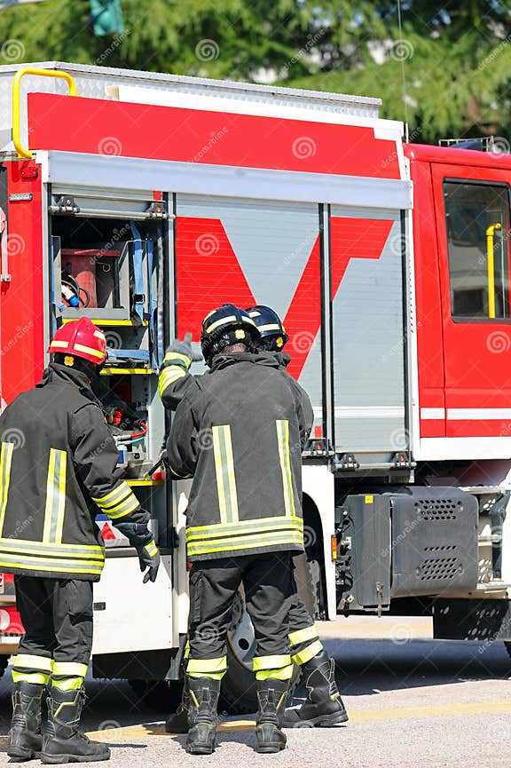 Firefighters Take Specialized Rescue Equipment from Red Fire Engine ...