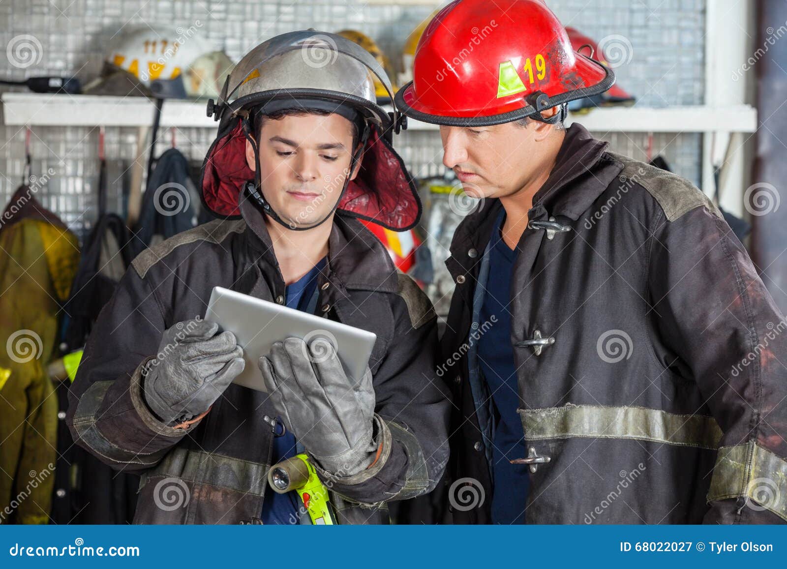Firefighters Using Digital Tablet at Fire Station Stock Image - Image ...
