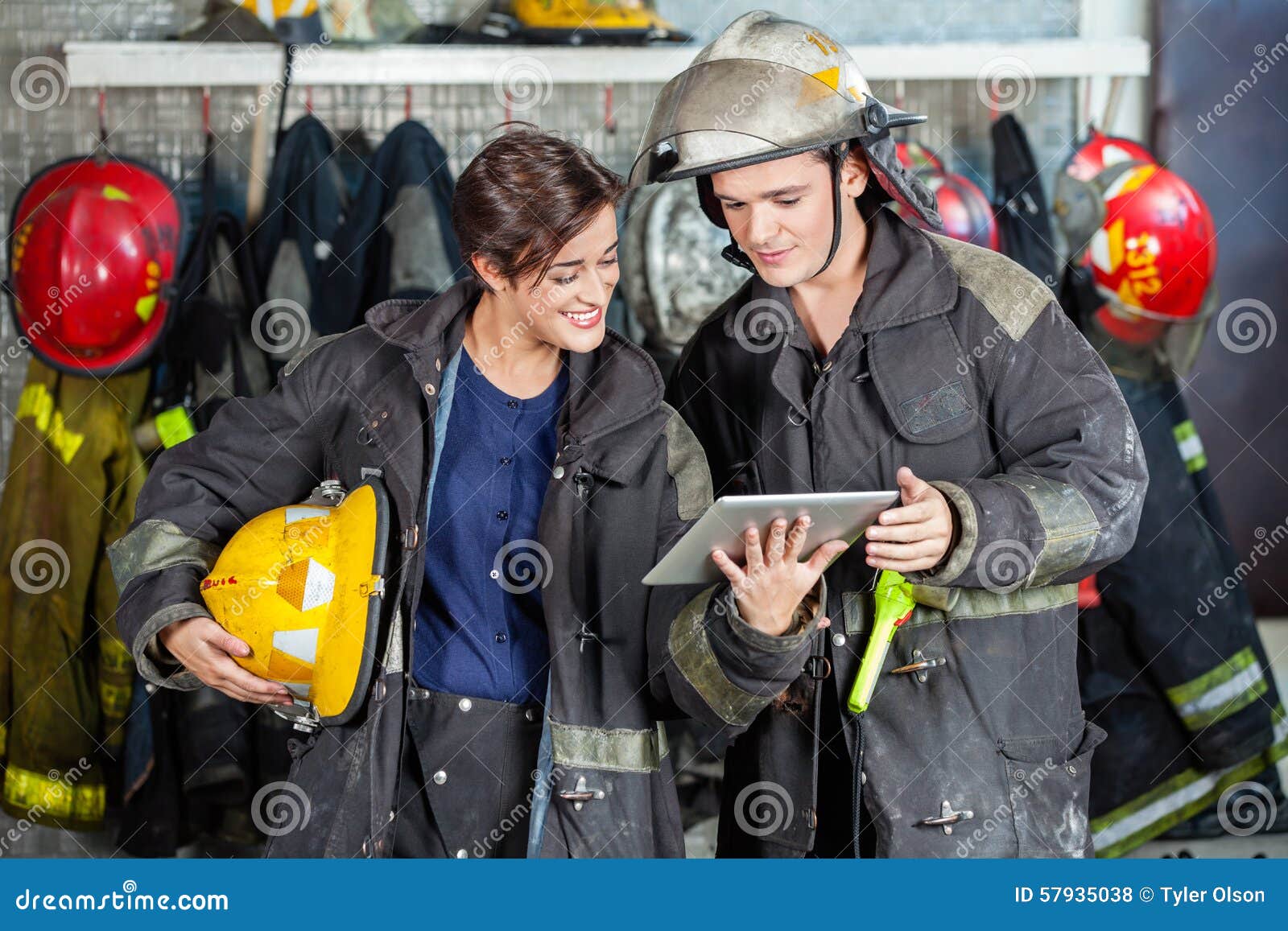 Firefighters Using Digital Tablet at Fire Station Stock Photo - Image ...